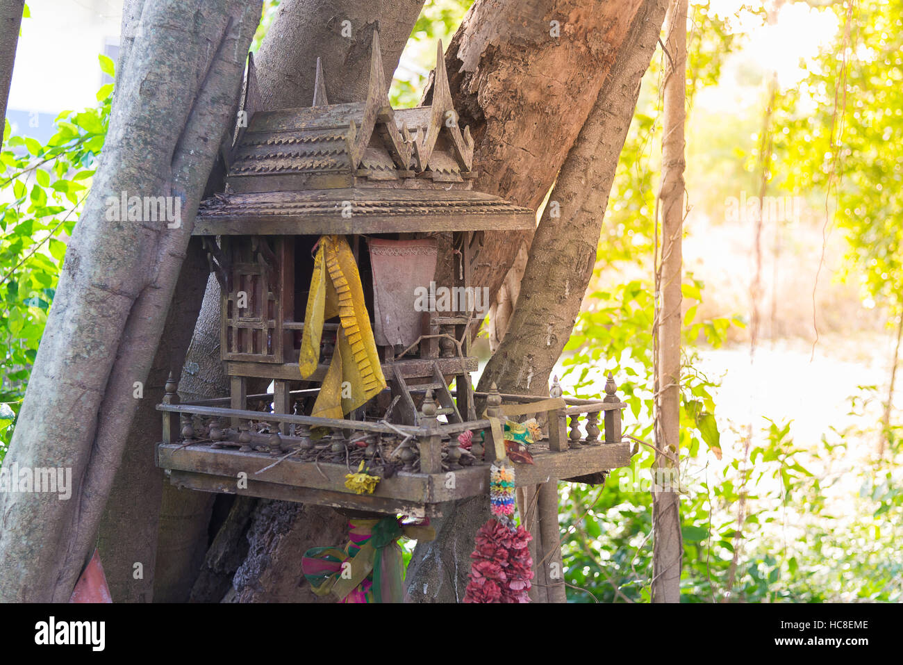 Ancient Thai outdoor spirit house shrine Thai style made from wood. In ...