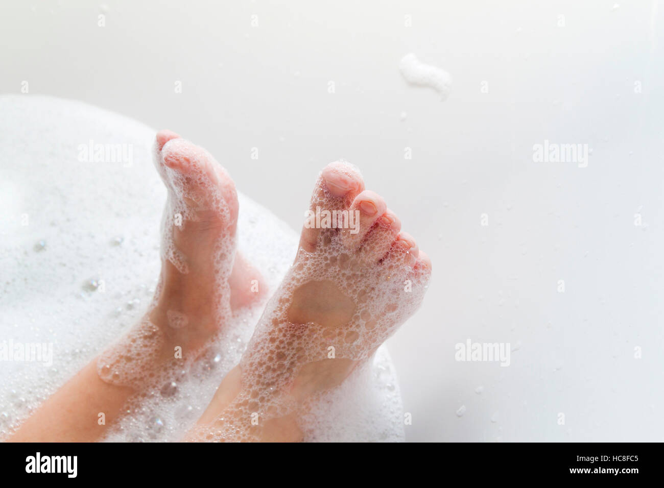Washing feet in shower hi-res stock photography and images - Alamy