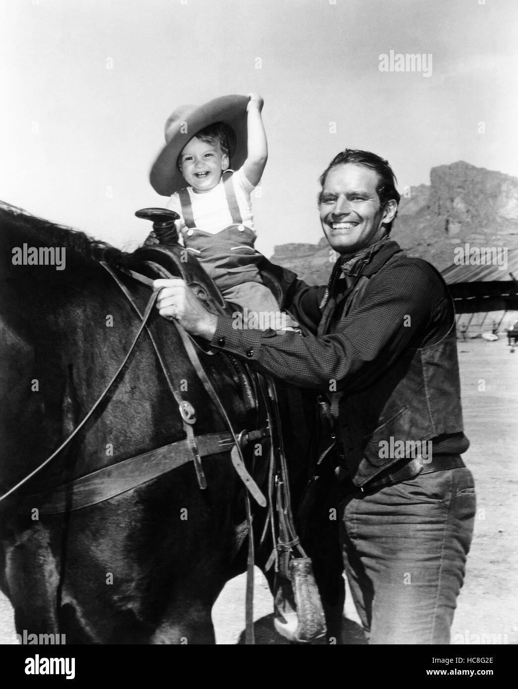 THREE VIOLENT PEOPLE, Charlton Heston with two year old son Fraser ...