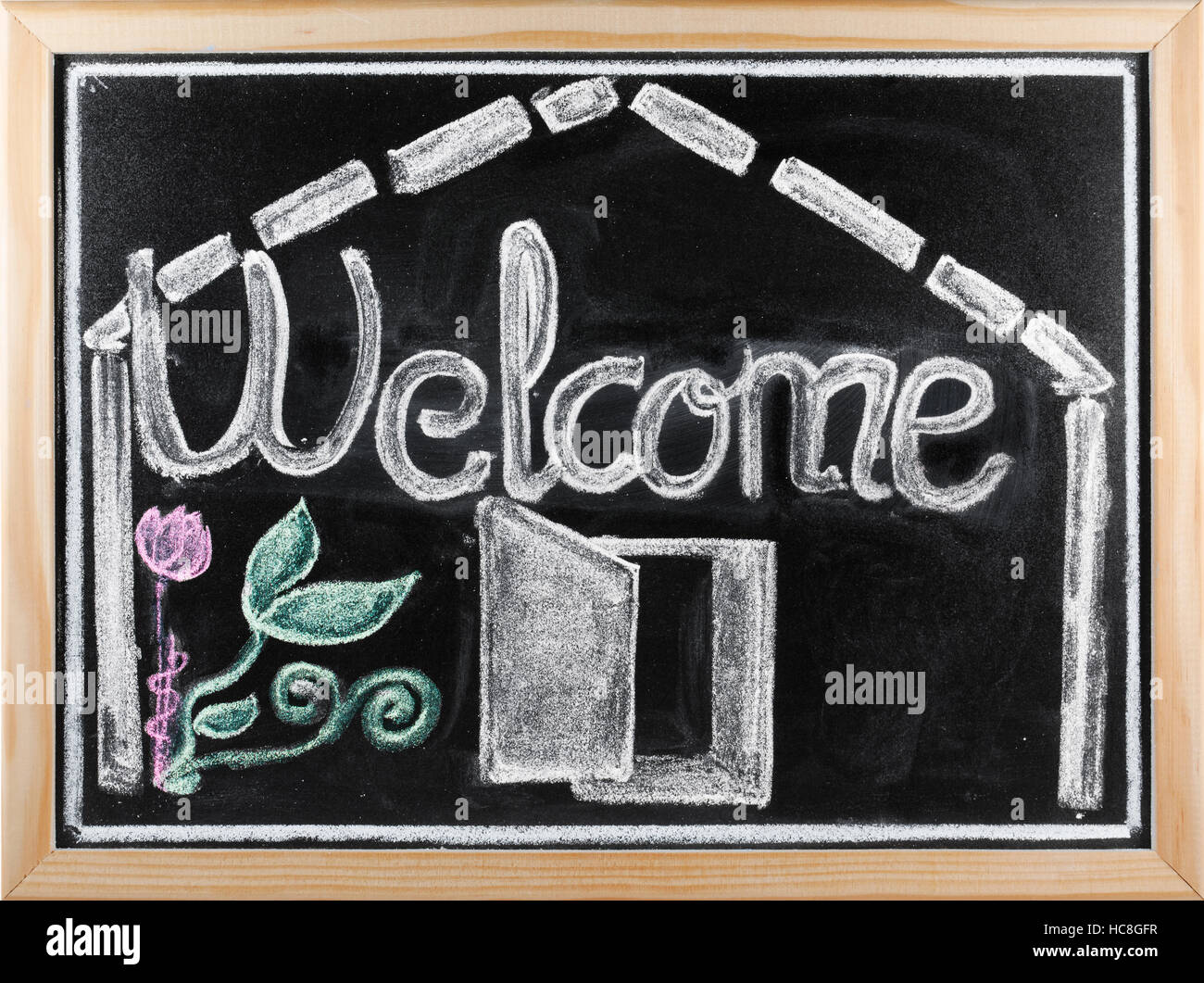 Welcome message written on a blackboard Stock Photo - Alamy