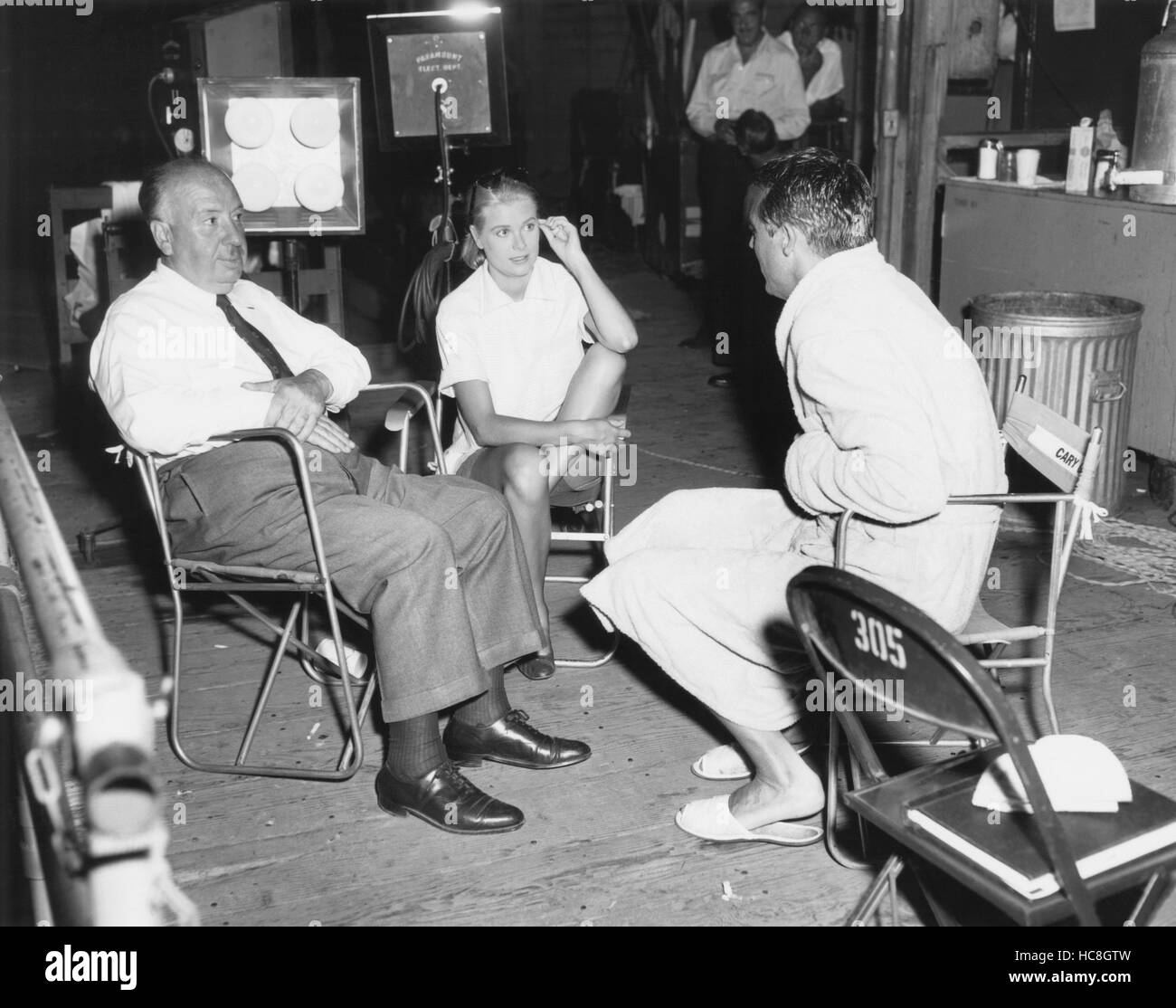 TO CATCH A THIEF, from left: director Alfred Hitchcock, Grace Kelly ...