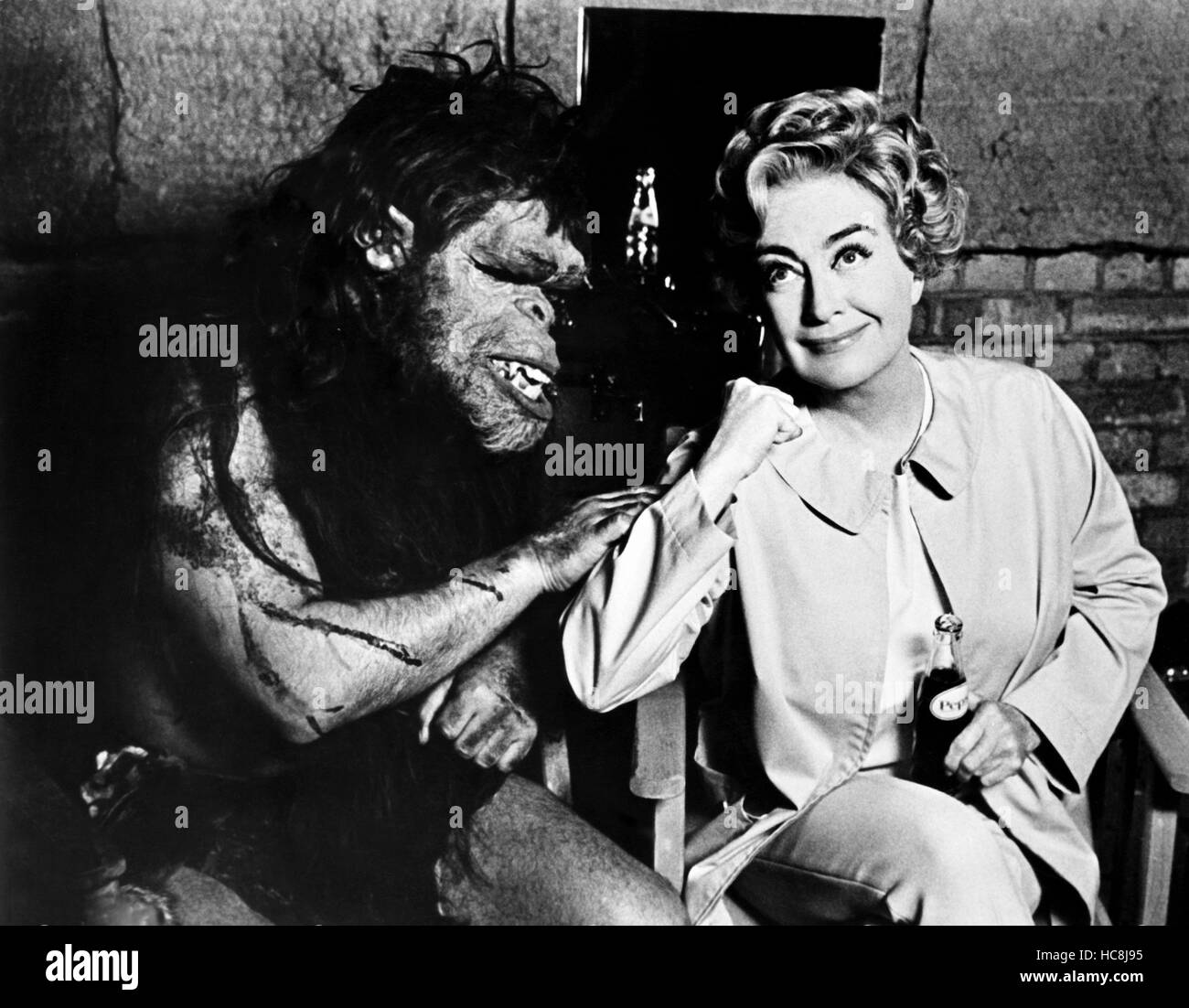 TROG, from left, Joe Cornelius, Joan Crawford, enjoying a Pepsi between ...