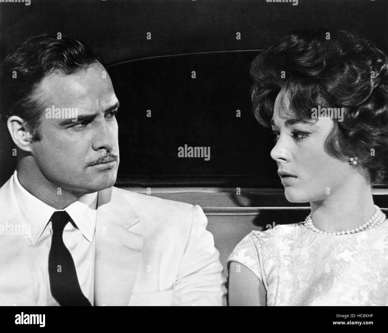 THE UGLY AMERICAN, from left: Marlon Brando, Sandra Church, 1963 Stock ...