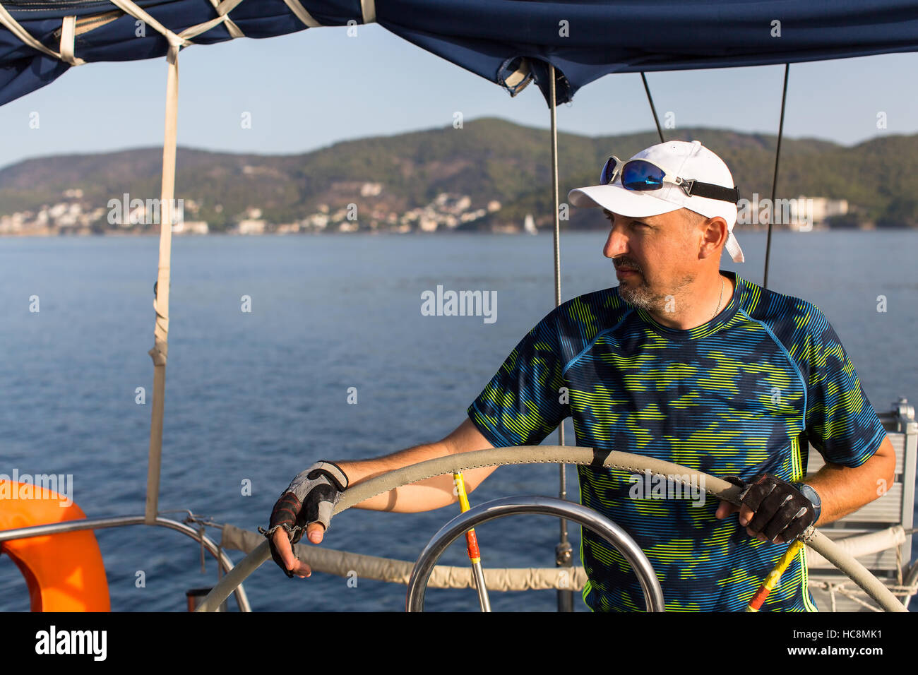 Man skipper during in the yachts boat race, sailing the Aegean sea ...