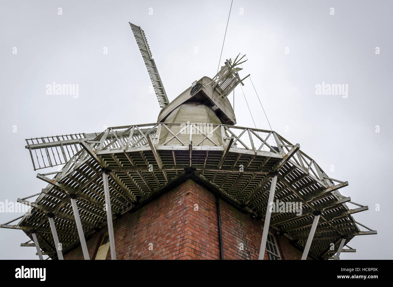 A white smock mill built in 1869 onto a two storey red brick base with ...