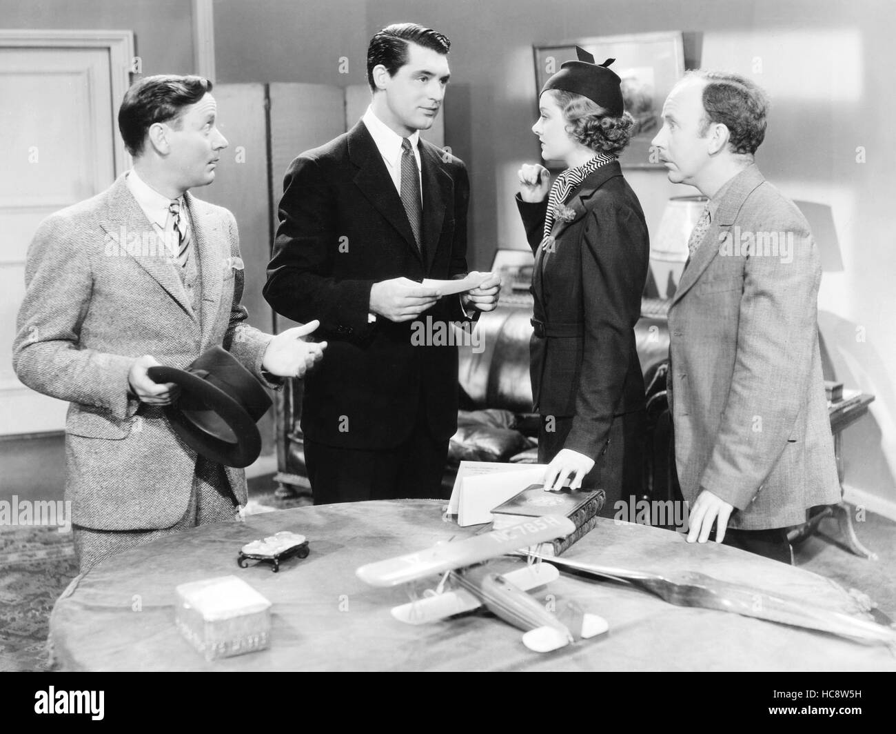 WINGS IN THE DARK, from left: Roscoe Karns, Cary Grant, Myrna Loy ...