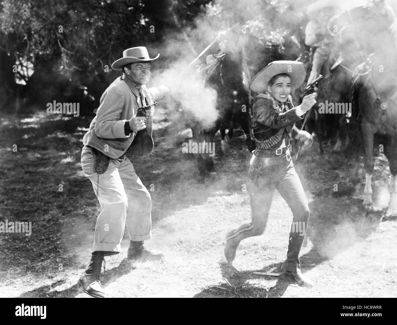 WINGS OF THE HAWK, from left: Van Heflin, Julie Adams, 1953 Stock Photo ...