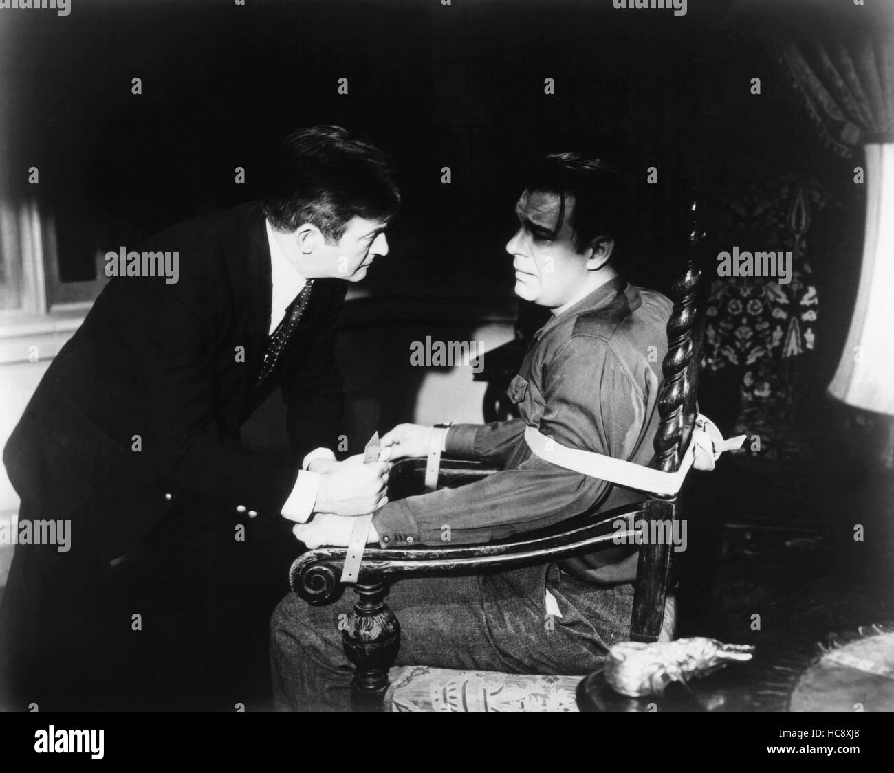 THE WOLF MAN, from left: Claude Rains, Lon Chaney Jr., 1941 Stock Photo ...