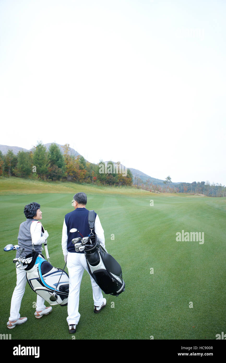 Senior asian couple in golf hi-res stock photography and images - Alamy