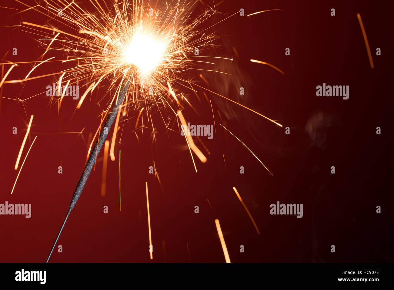 Red backdrop with bengal fire Stock Photo - Alamy