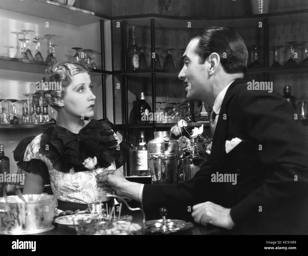 UNCERTAIN LADY, from left: Genevieve Tobin, Donald Reed, 1934 Stock ...