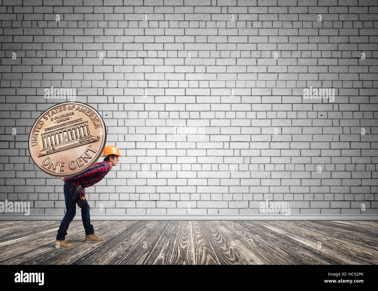 Builder man carry coin Stock Photo - Alamy