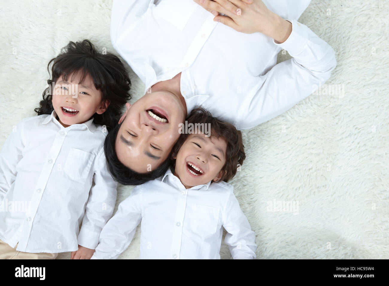 Portrait ogf smiling boy and girl with their father Stock Photo - Alamy