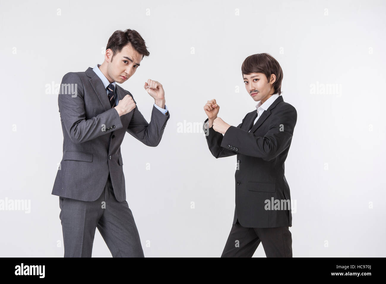 Three business people fighting hi-res stock photography and images - Alamy
