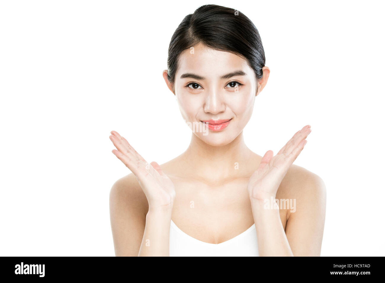 Portrait of young smiling woman holding her hands Stock Photo - Alamy