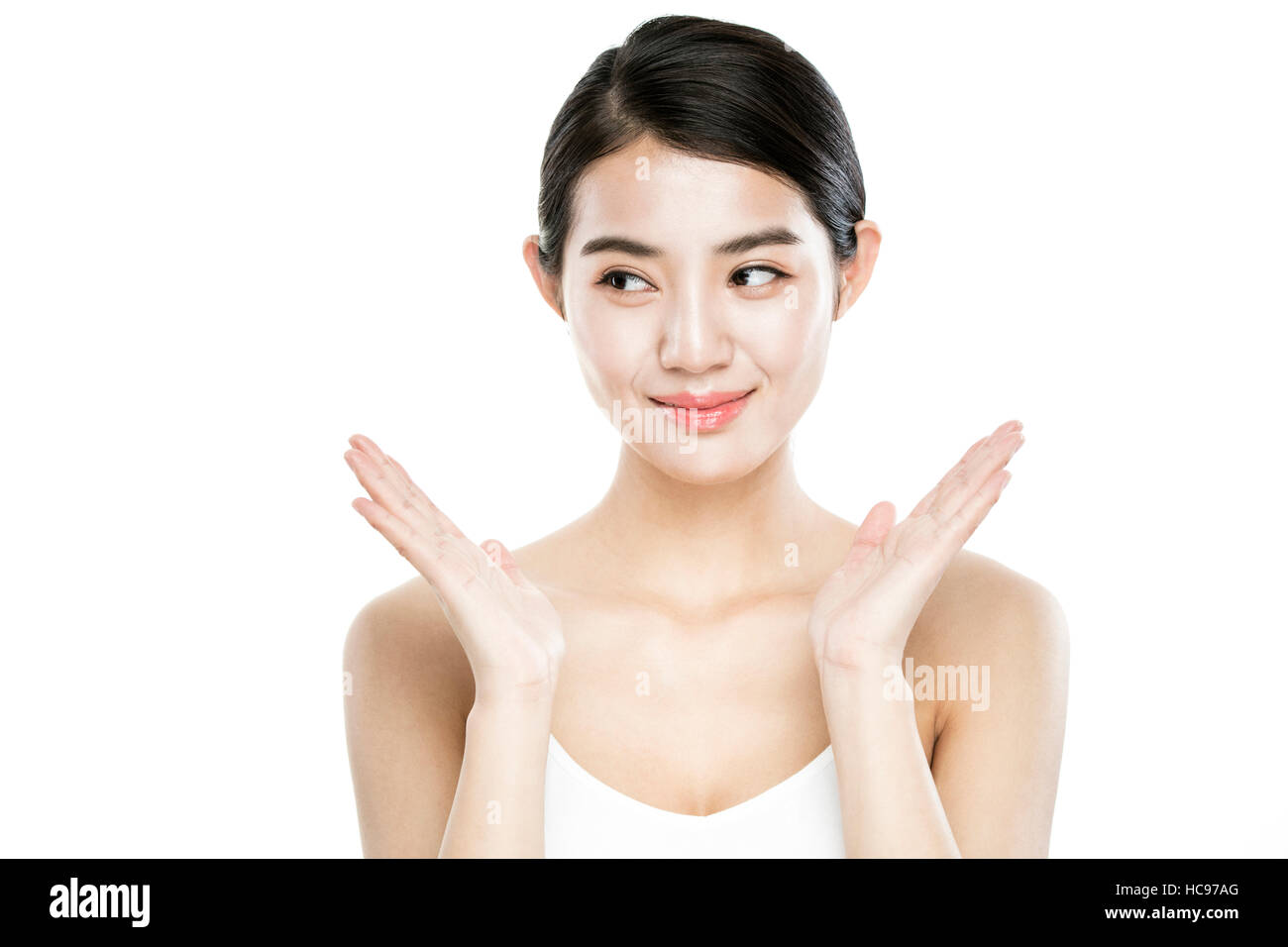 Portrait of young smiling woman holding her hands Stock Photo - Alamy