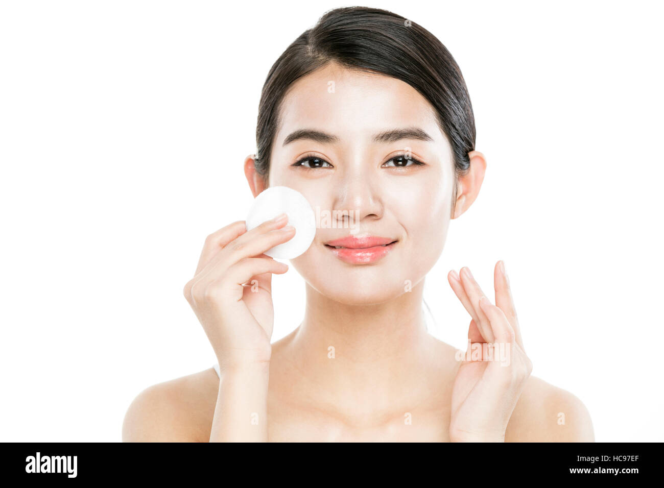 Portrait of young smiling woman using a puff Stock Photo - Alamy