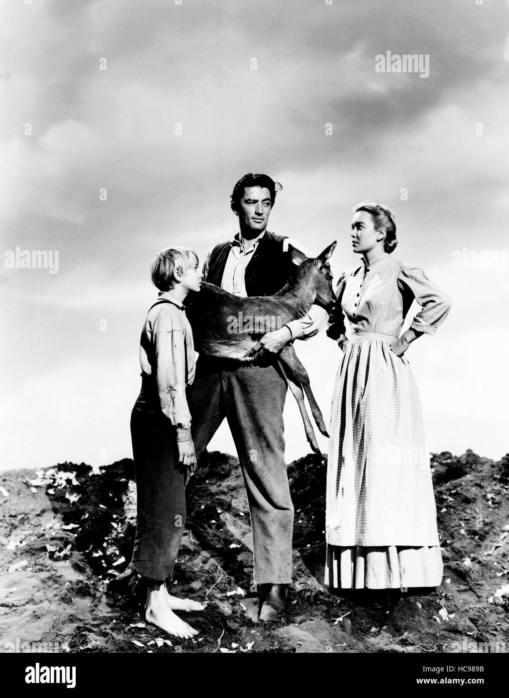 THE YEARLING, from left, Claude Jarman, Jr., Gregory Peck, Jane Wyman ...