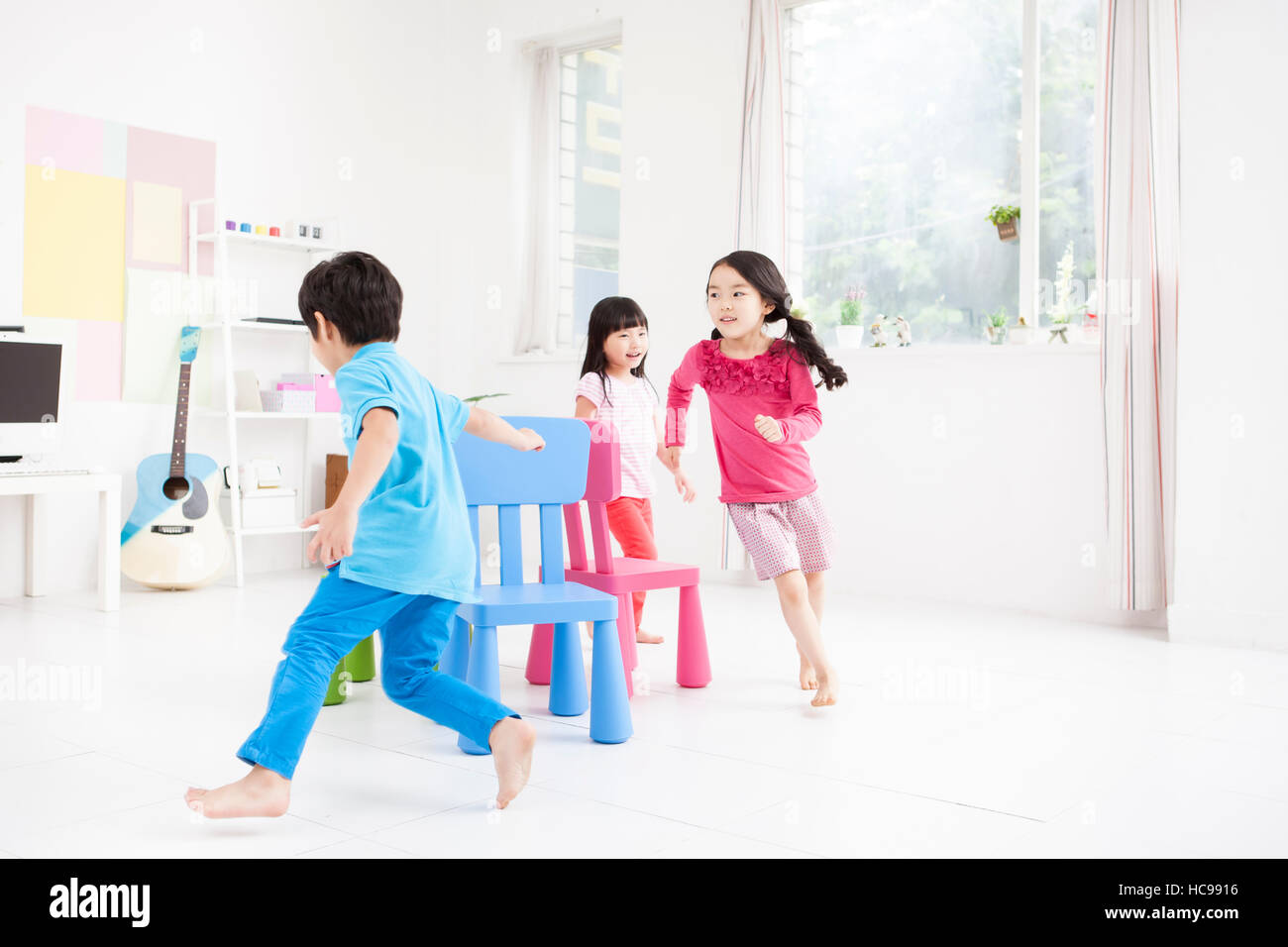 Children running indoors Stock Photo - Alamy