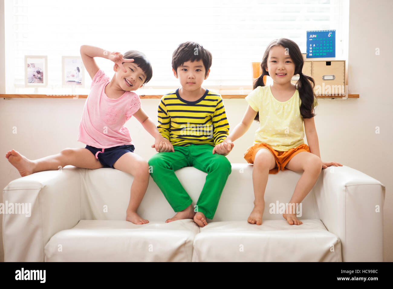 Children posing hi-res stock photography and images - Alamy