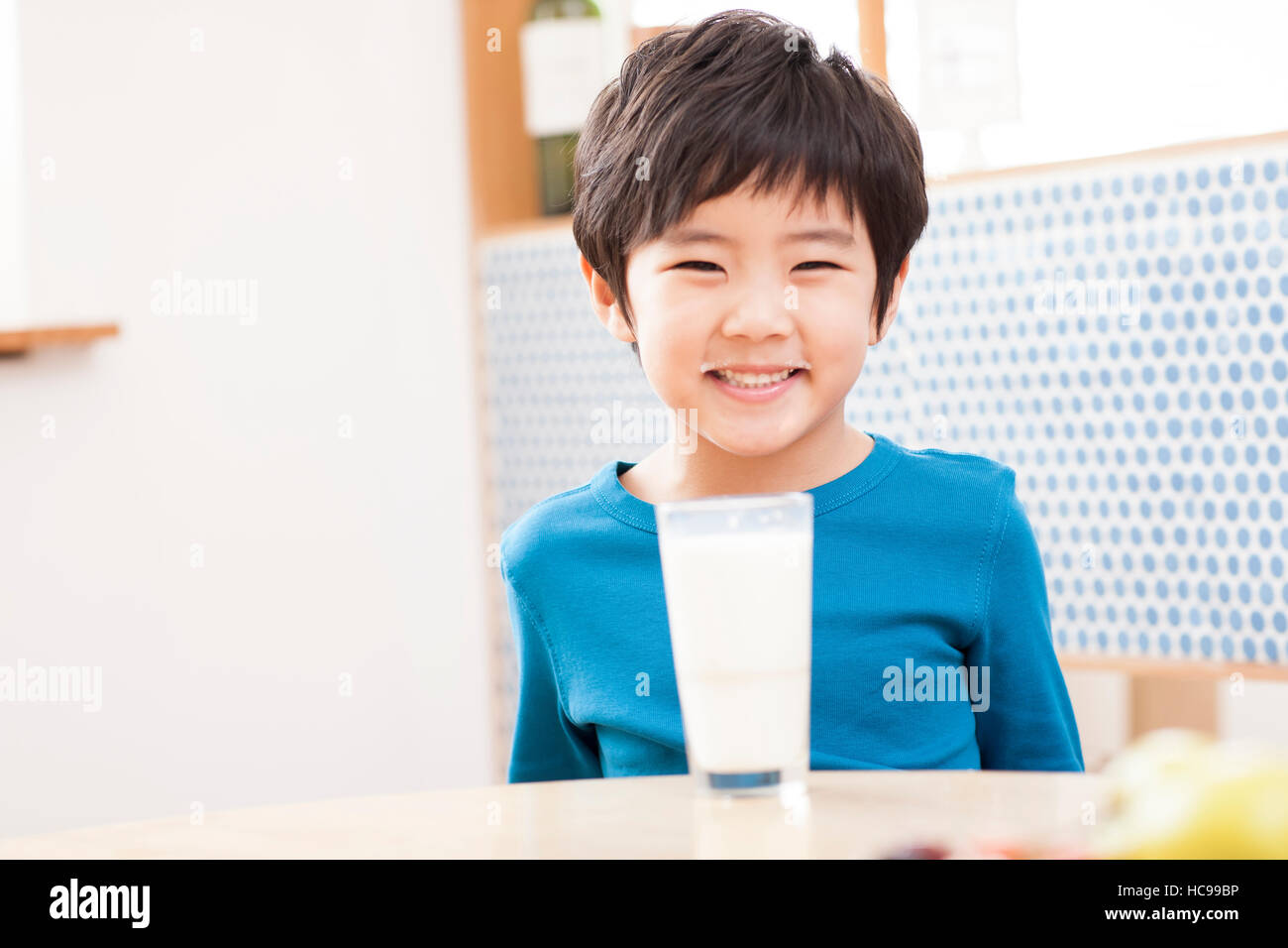 Portrait of smiling boy with milk Stock Photo - Alamy