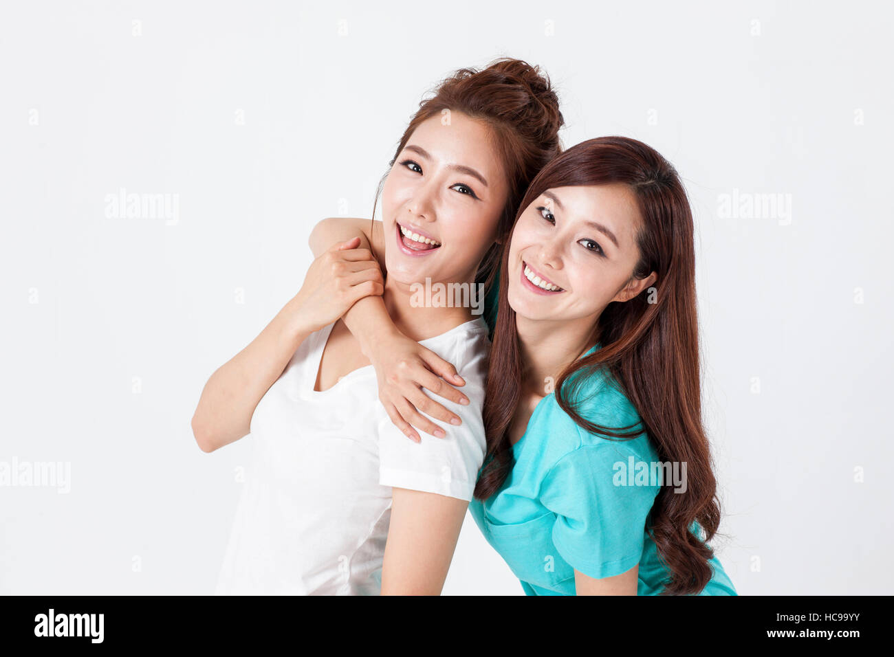 Portrait of two young smiling women Stock Photo - Alamy