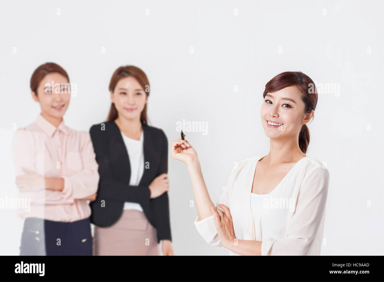 Three young smiling businesswomen Stock Photo - Alamy Three young smiling businesswomen Stock Photo - Alamy