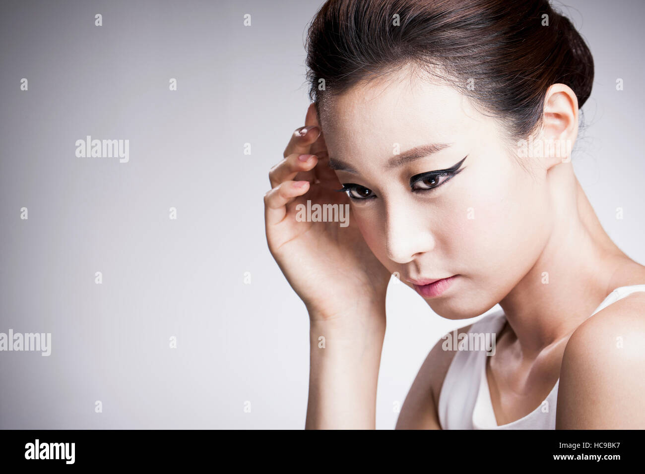 Side view portrait of young Korean woman in black eye liner Stock Photo ...