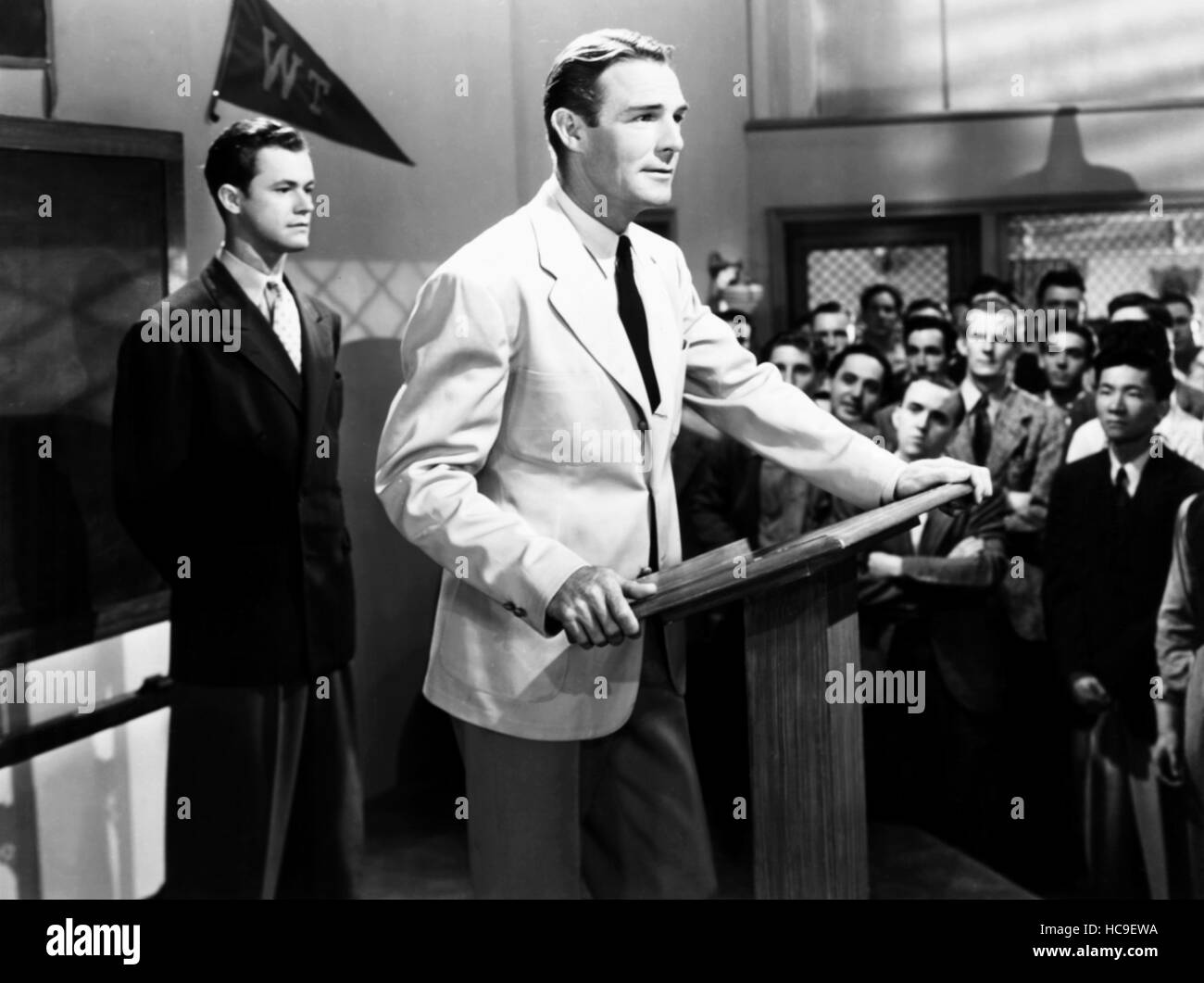 20,000 MEN A YEAR, Randolph Scott (at podium), 1939, TM & Copyright ...