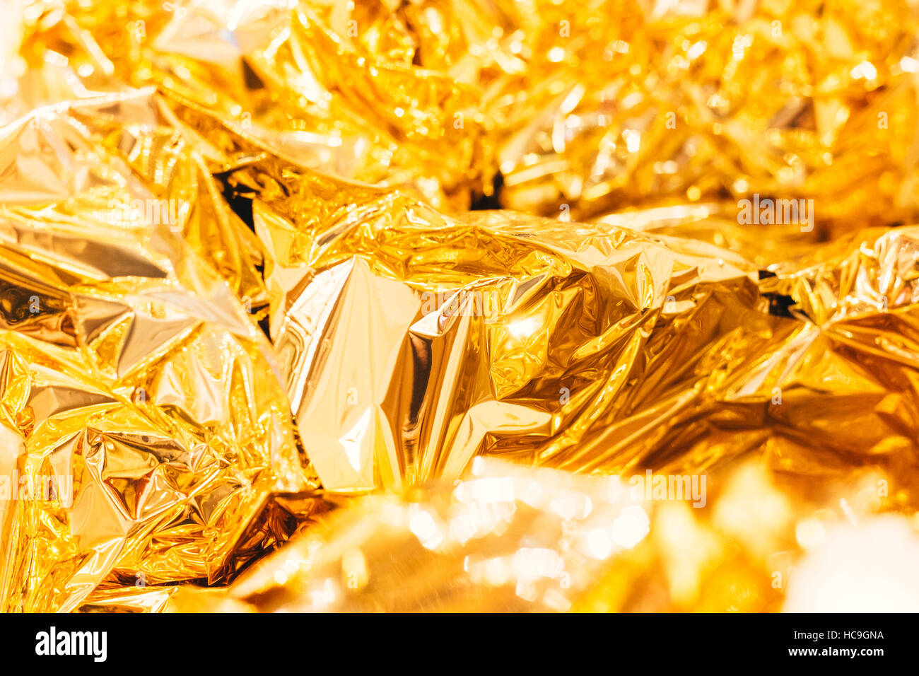 Shiny yellow leaf gold foil texture background Stock Photo - Alamy