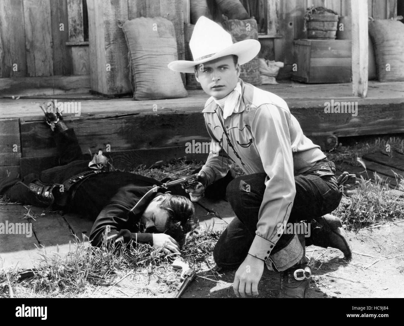 WESTERN TRAILS, from left: Bob Baker, John Ridgely, 1938 Stock Photo ...