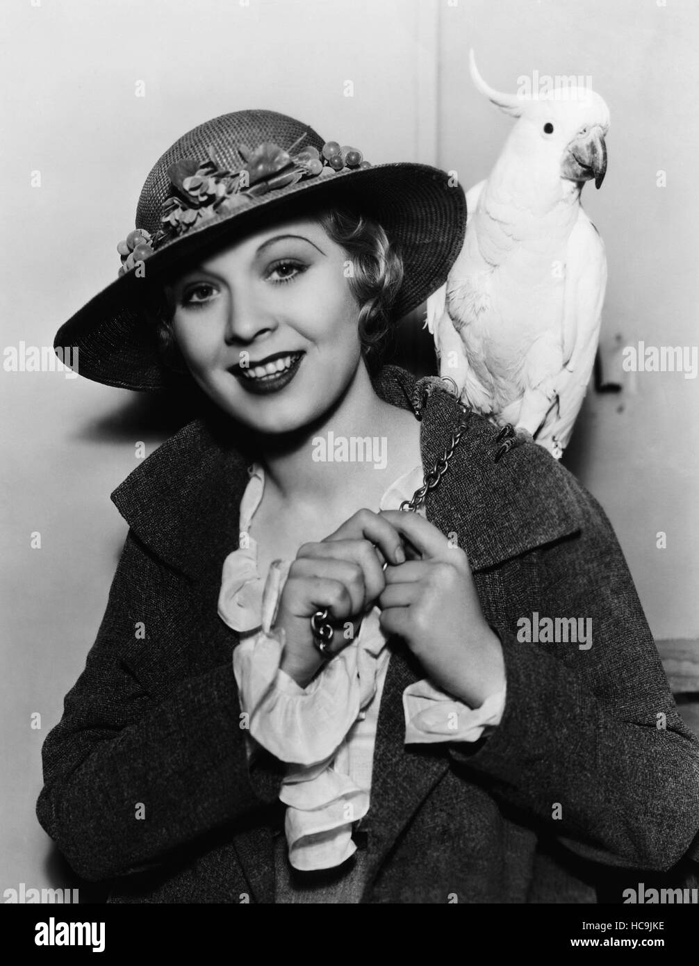 WHARF ANGEL, Dorothy Dell, posing with a cockatoo used in the film, 1934 Stock Photo - Alamy