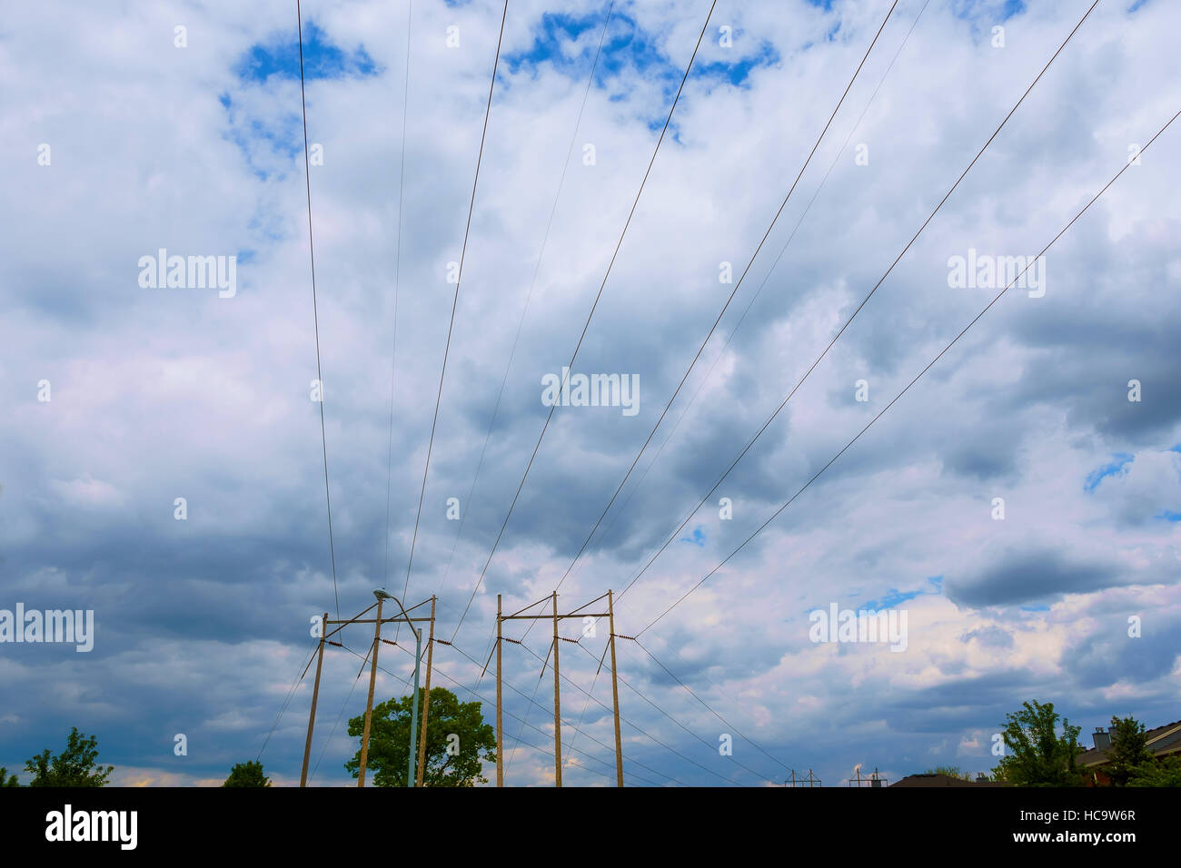 Electrical power line against cloud and blue sky Stock Photo - Alamy