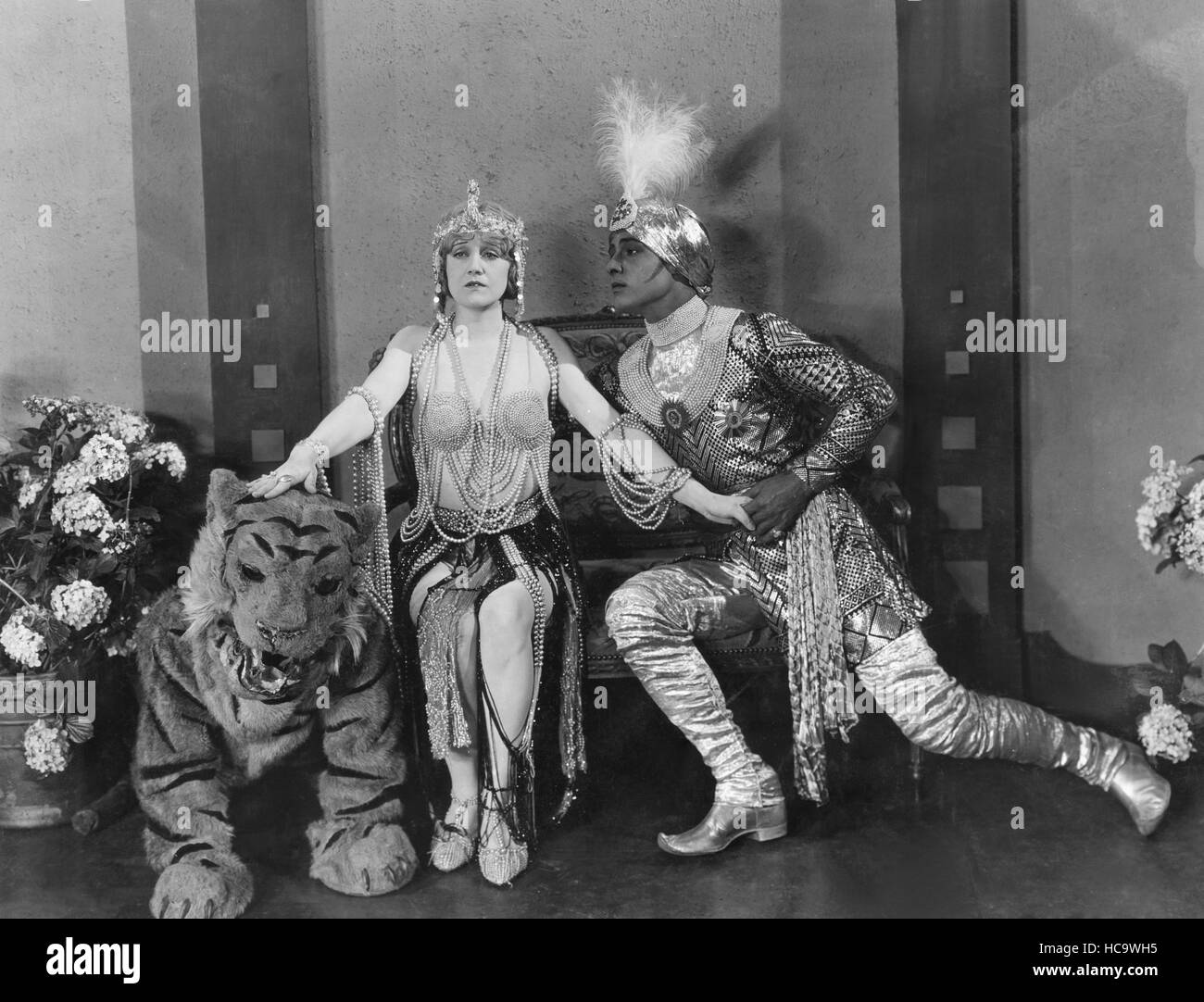 THE YOUNG RAJAH, from left: Maude Wayne, Rudolph Valentino having some ...