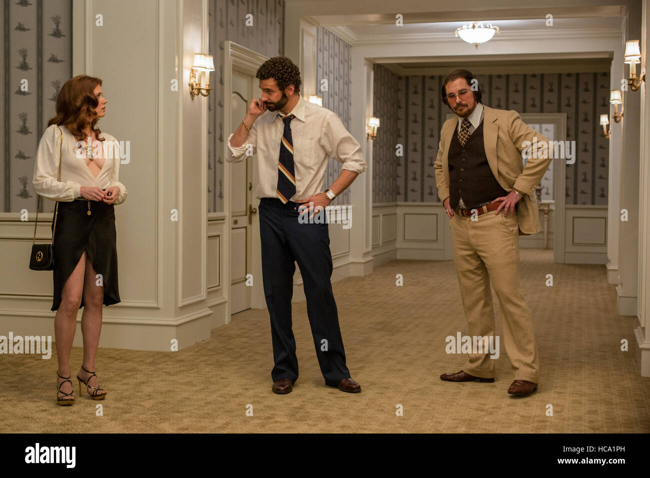 AMERICAN HUSTLE, from left: Amy Adams, Bradley Cooper, Christian Bale ...