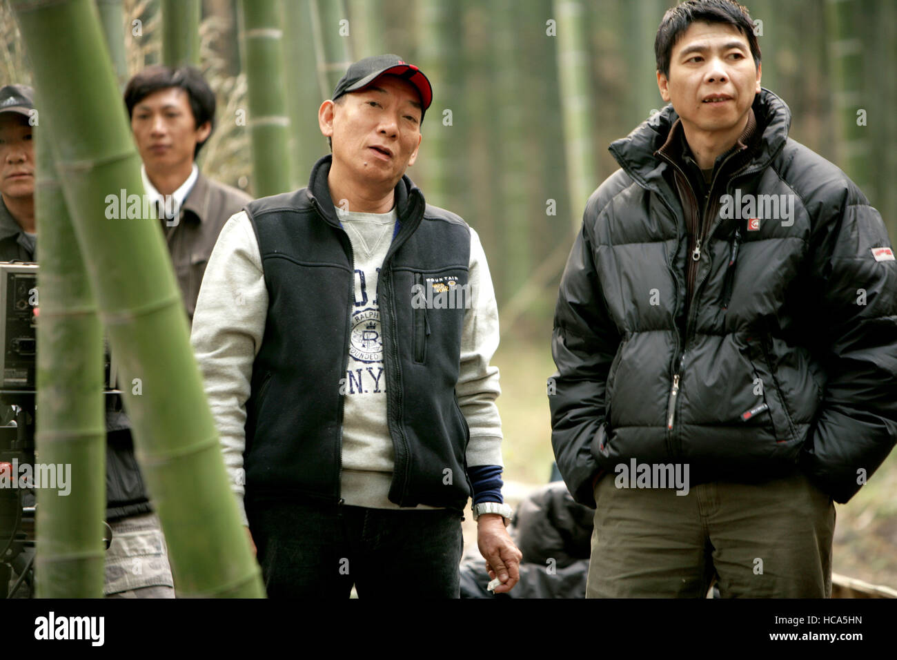 THE BANQUET, (aka YE YAN), writer/director Xiaogang Feng (center), on ...