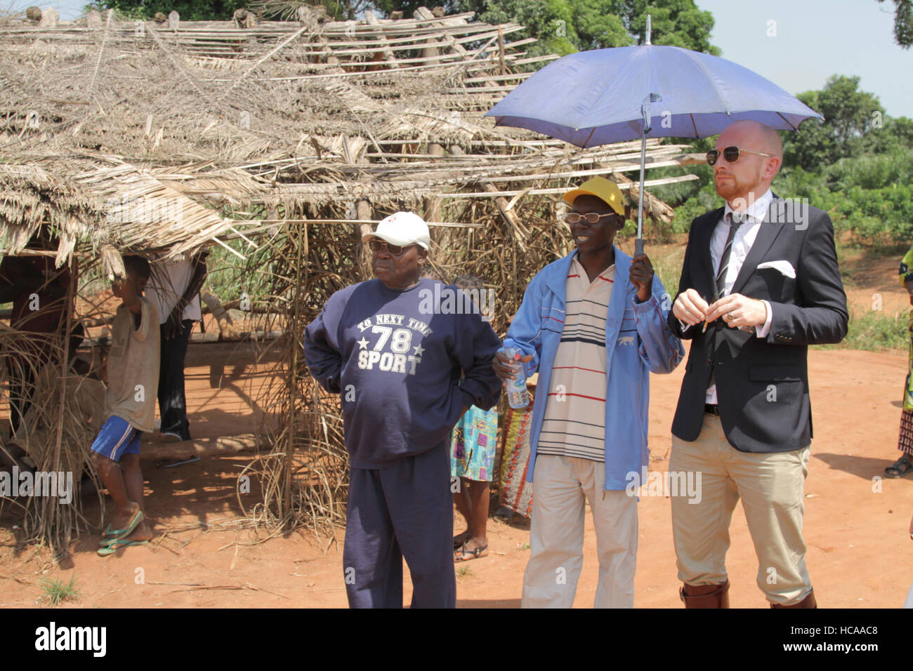 THE AMBASSADOR, Mads Brugger (right), Paul and Minister Gaston ...