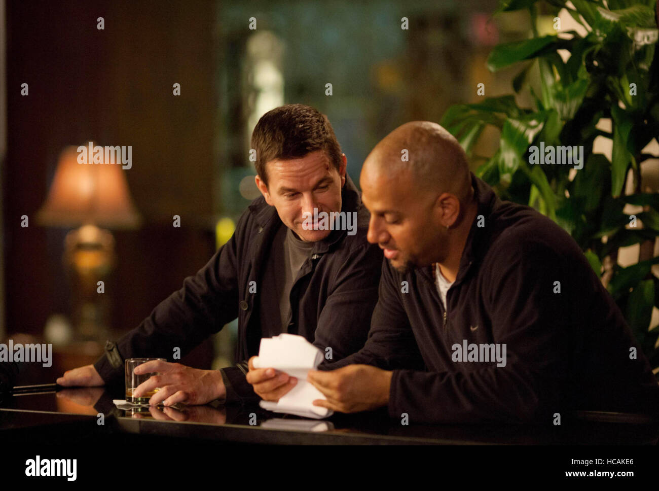BROKEN CITY, from left: Mark Wahlberg, director Allen Hughes, on set ...
