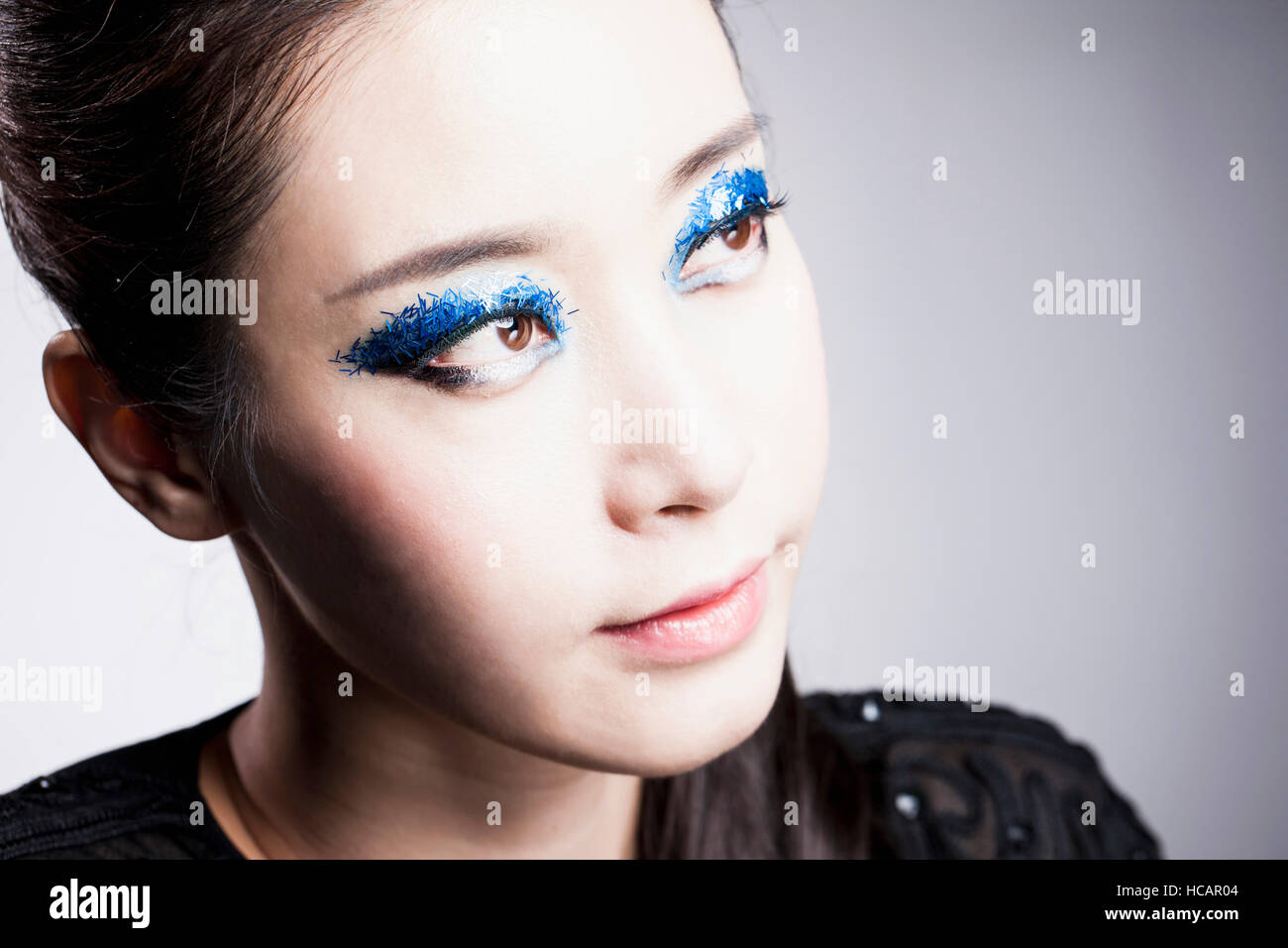 Portrait of young.Korean woman in blue eye shadow Stock Photo - Alamy