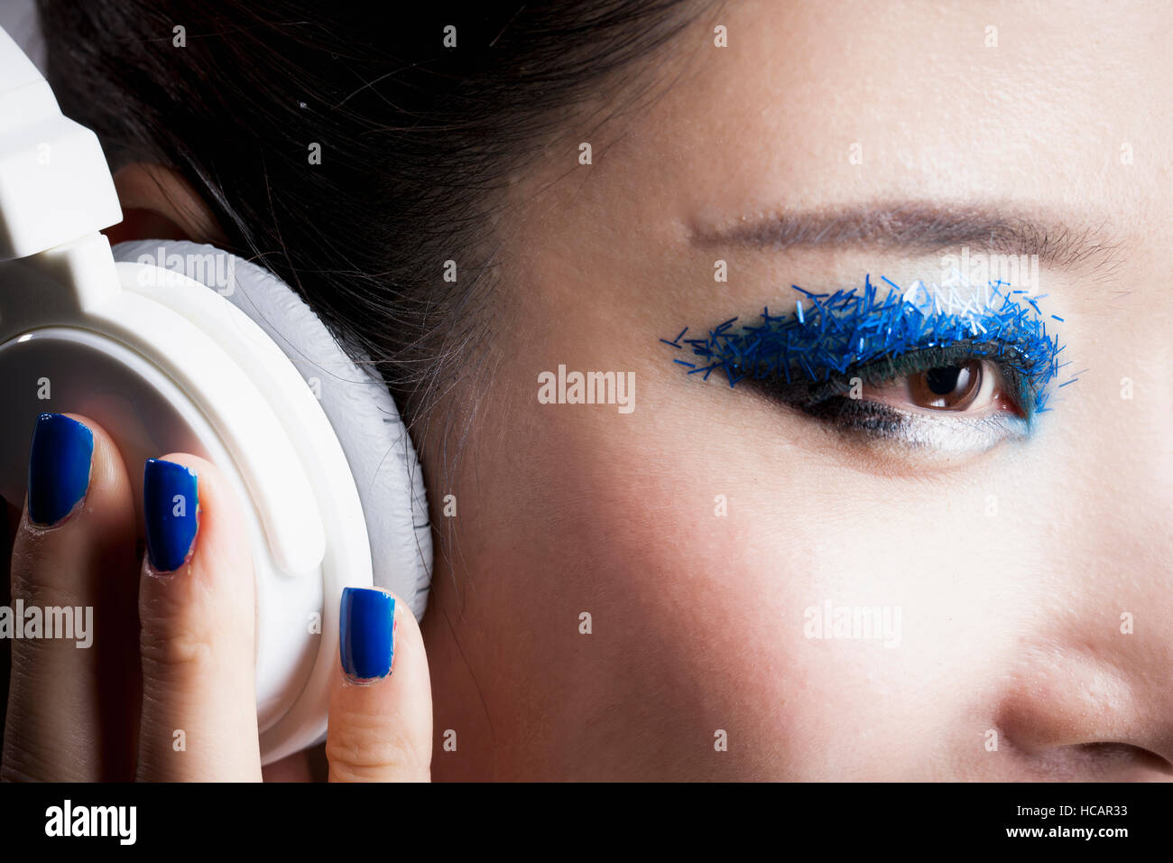 Portrait of young woman in blue eye shadow Stock Photo - Alamy