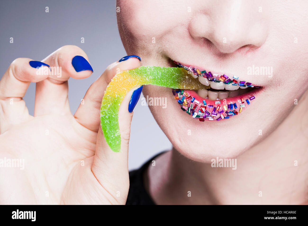 Close up of Korean woman's face eating jelly Stock Photo - Alamy
