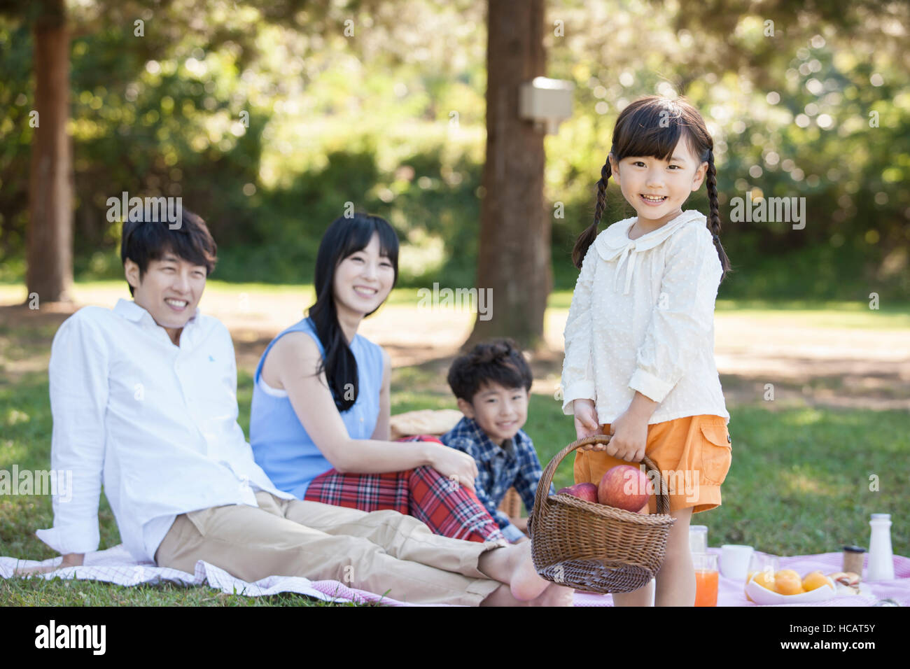 Harmonious family having a picnic Stock Photo - Alamy