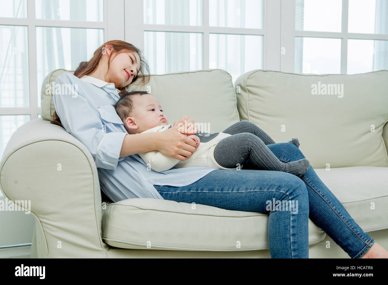 Loving mother taking care of her baby Stock Photo - Alamy