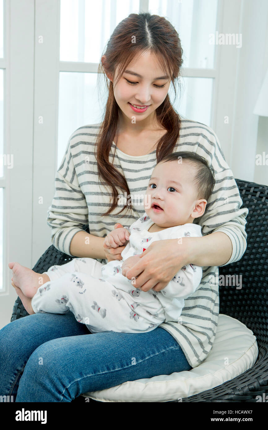 Loving mother hugging her baby Stock Photo - Alamy