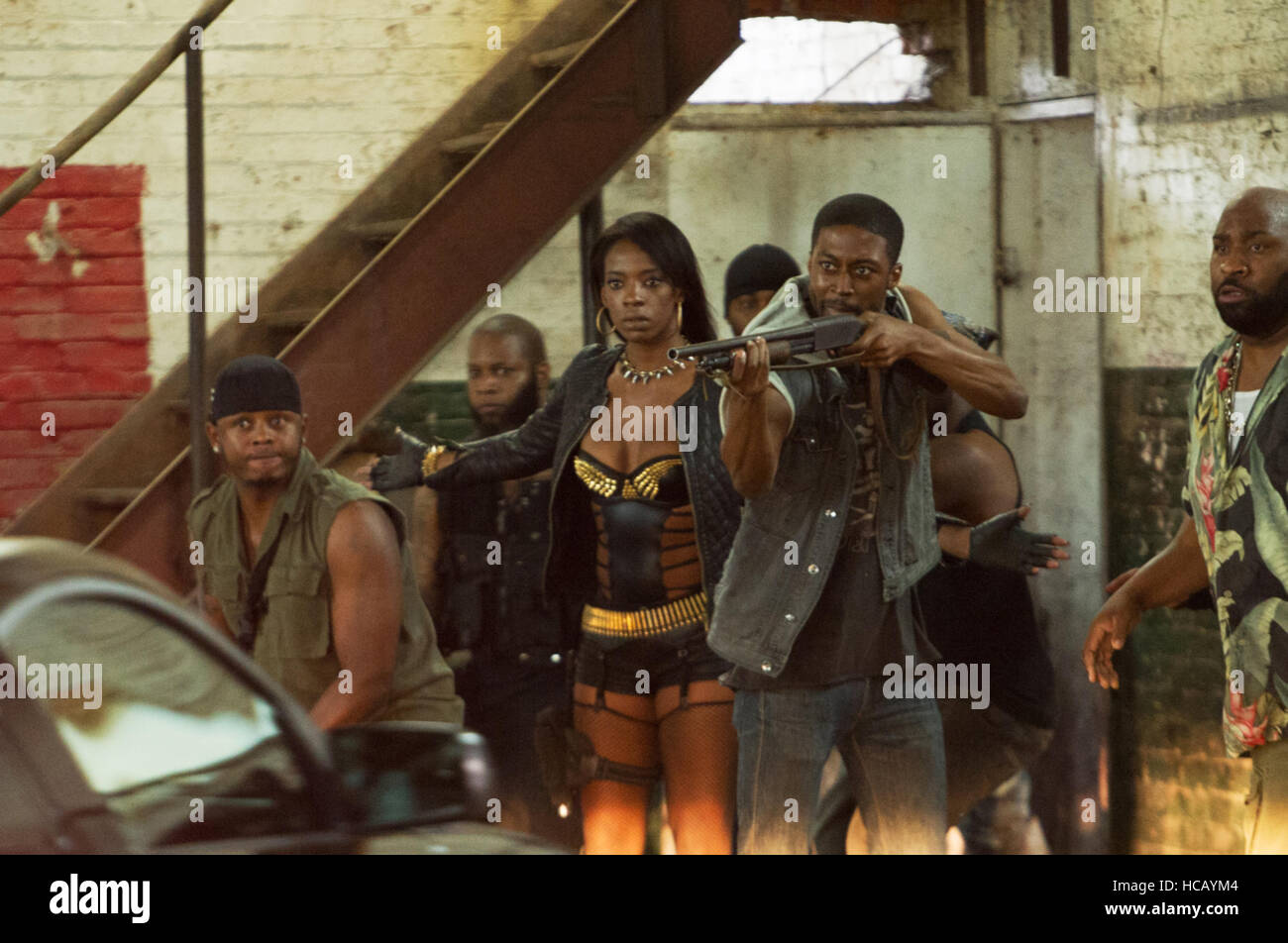 BRICK MANSIONS, Ayisha Issa (in gold and black), Gouchy Boy (far right ...