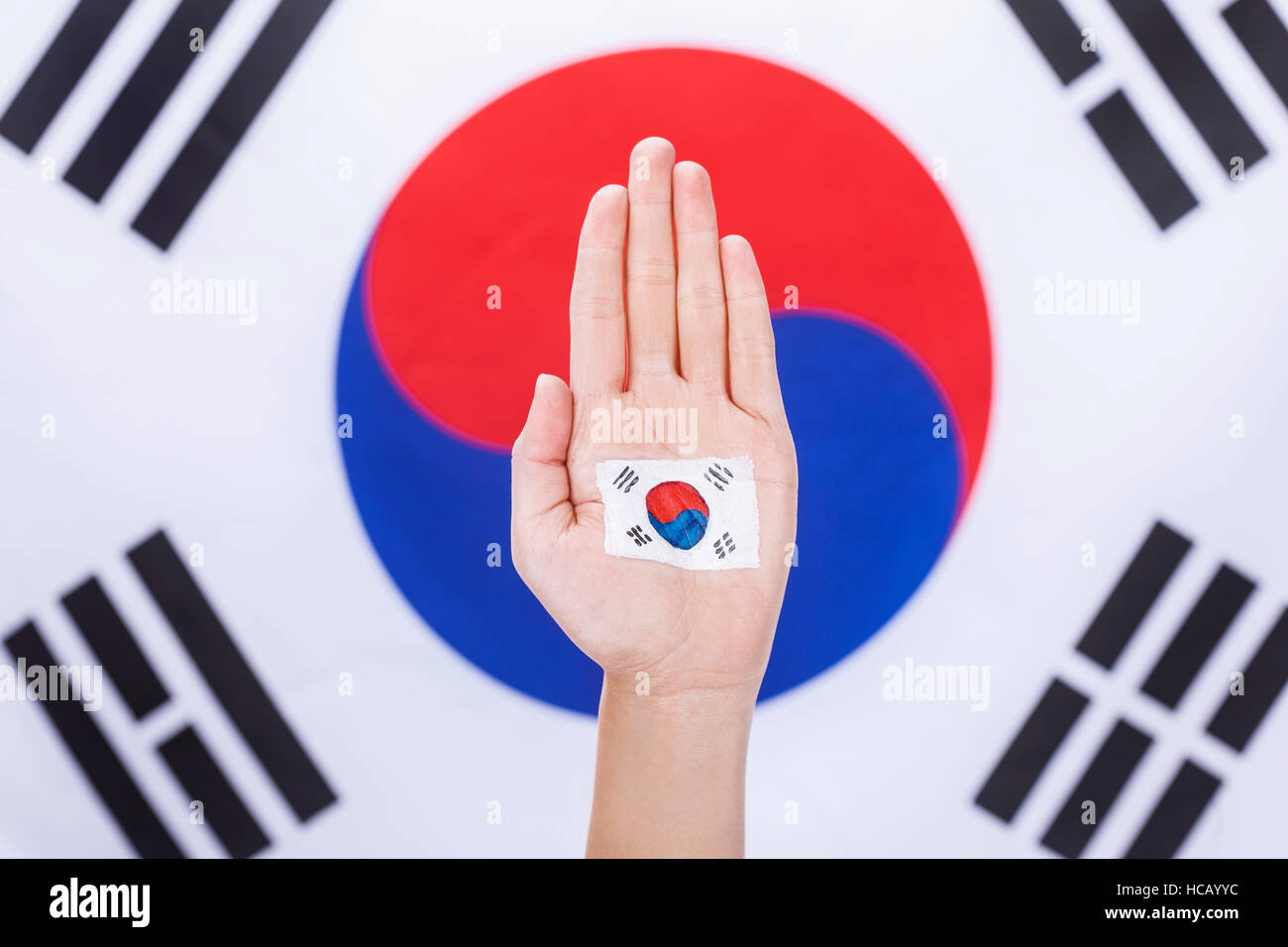 Hand against Korean flag Stock Photo - Alamy
