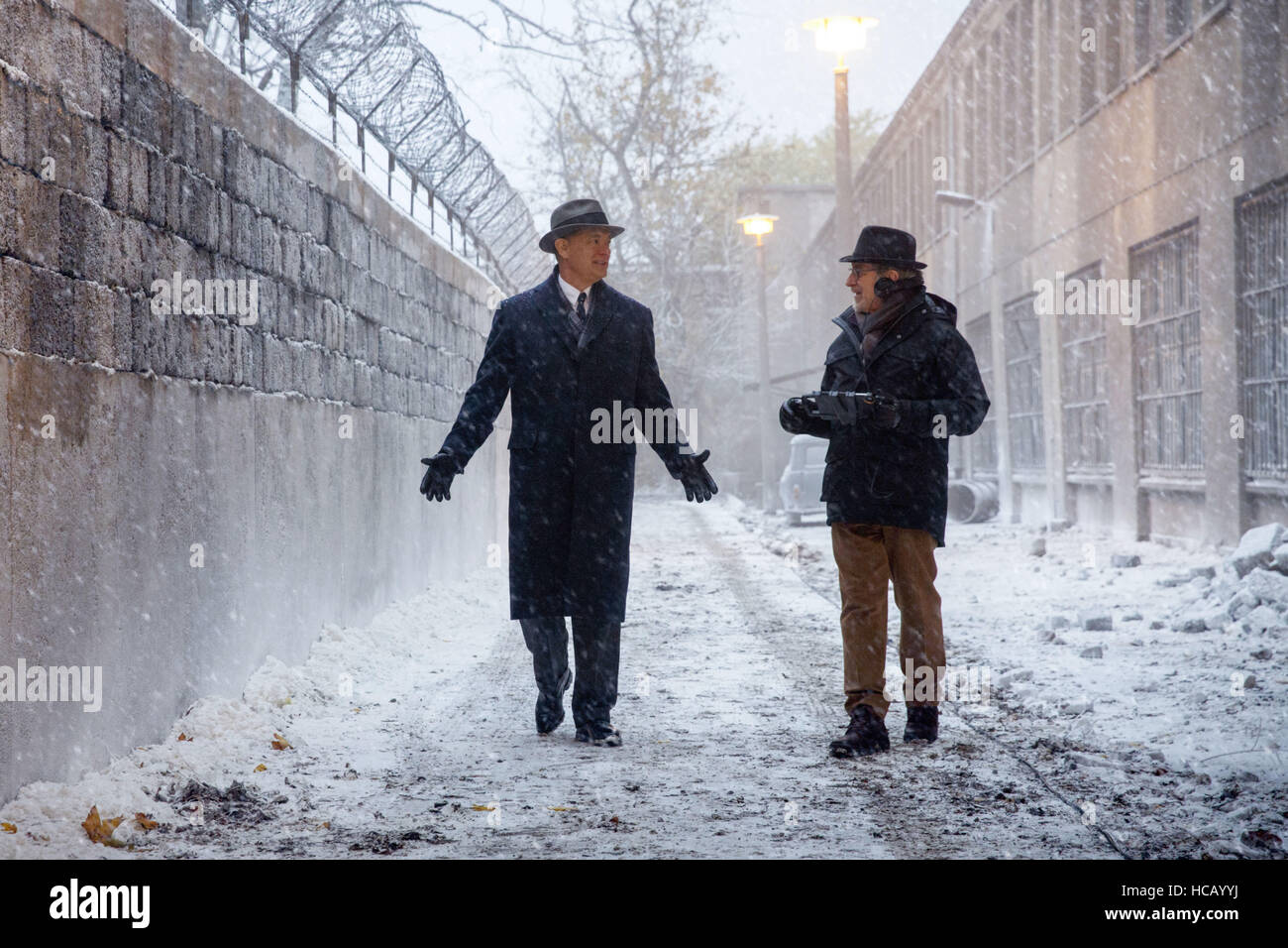 BRIDGE OF SPIES, from left: Tom Hanks, director Steven Spielberg, on set, 2015. ph: Jaap ...