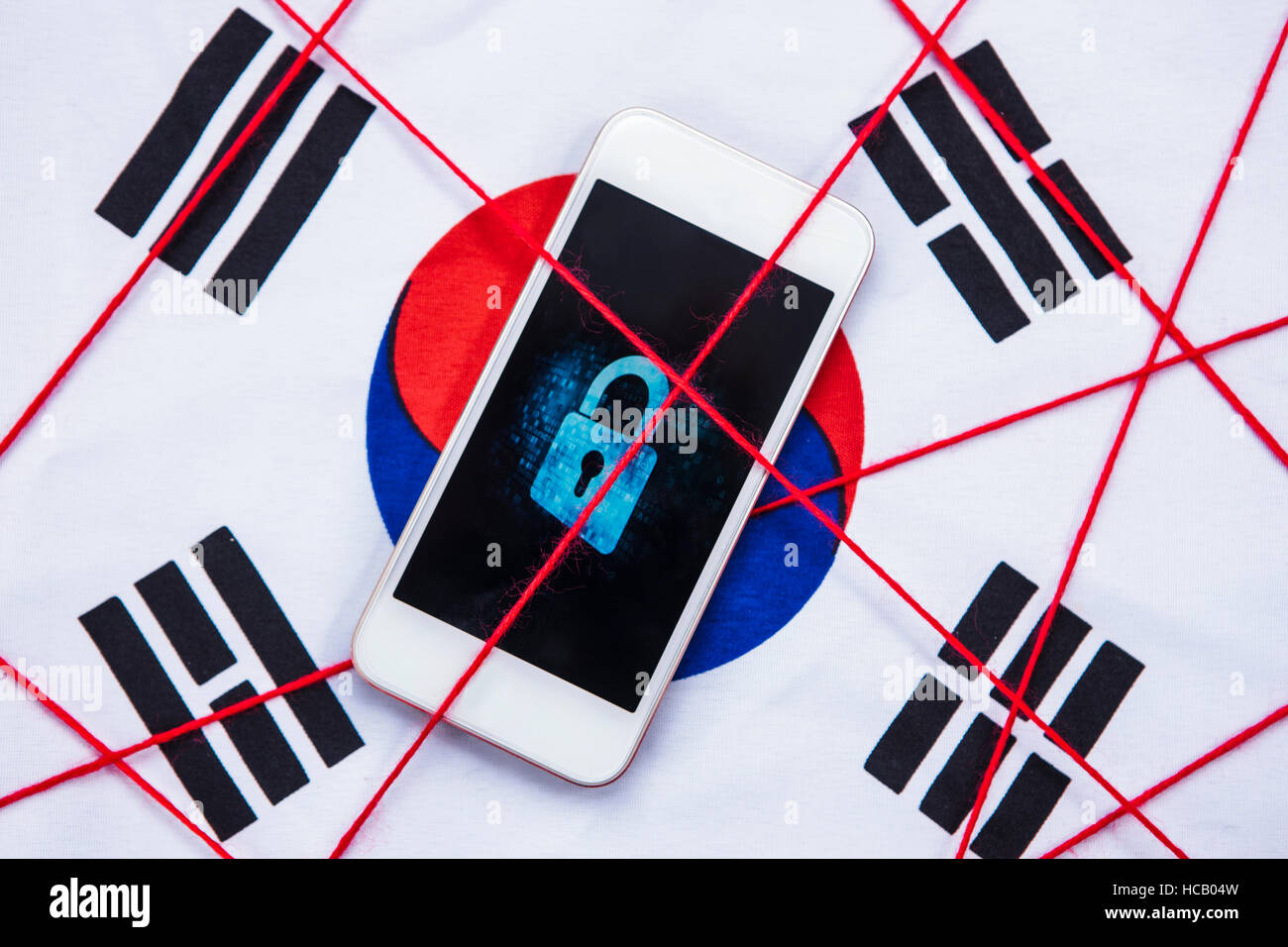 Smartphone and Korean flag tied up with rope Stock Photo - Alamy