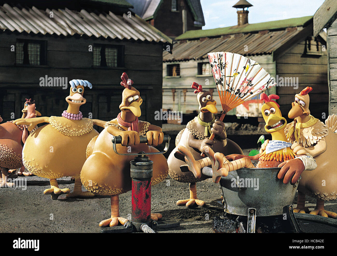 CHICKEN RUN, 2000, Rocky (Mel Gibson), pampered by the hens. Babs (Jane ...