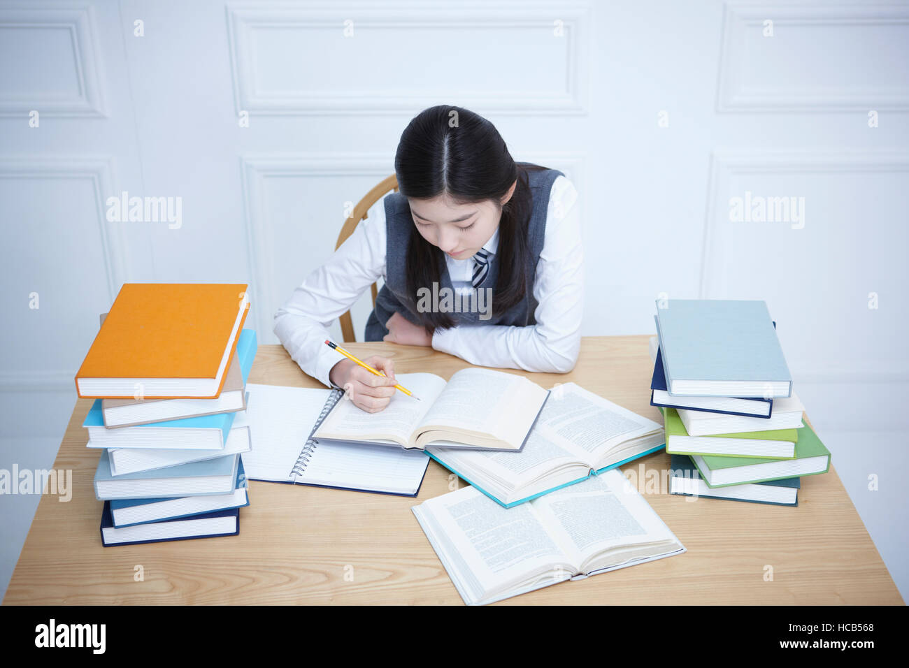 High angle view portrait of middle school girl studying Stock Photo - Alamy